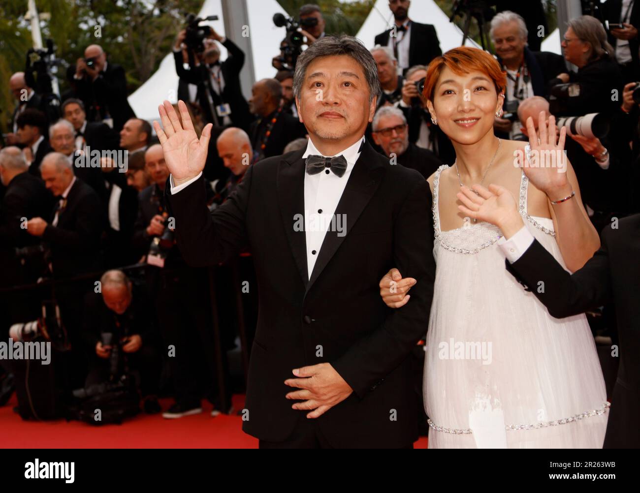Director Hirokazu Koreeda, left, and Sakura Ando pose for photographers ...