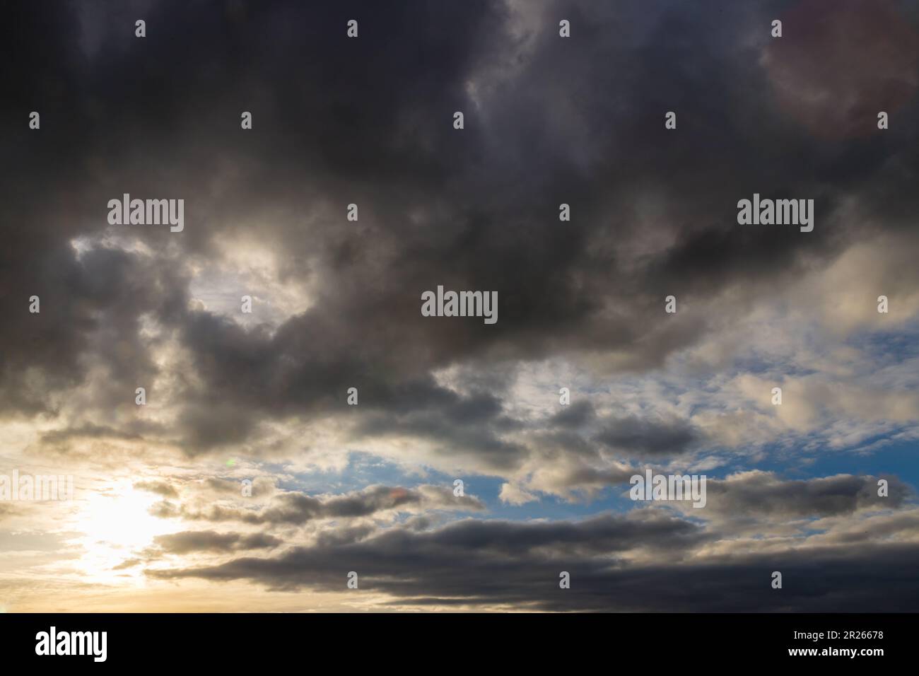 dark rain clouds broken by the sun - Stratocumulus Stock Photo - Alamy