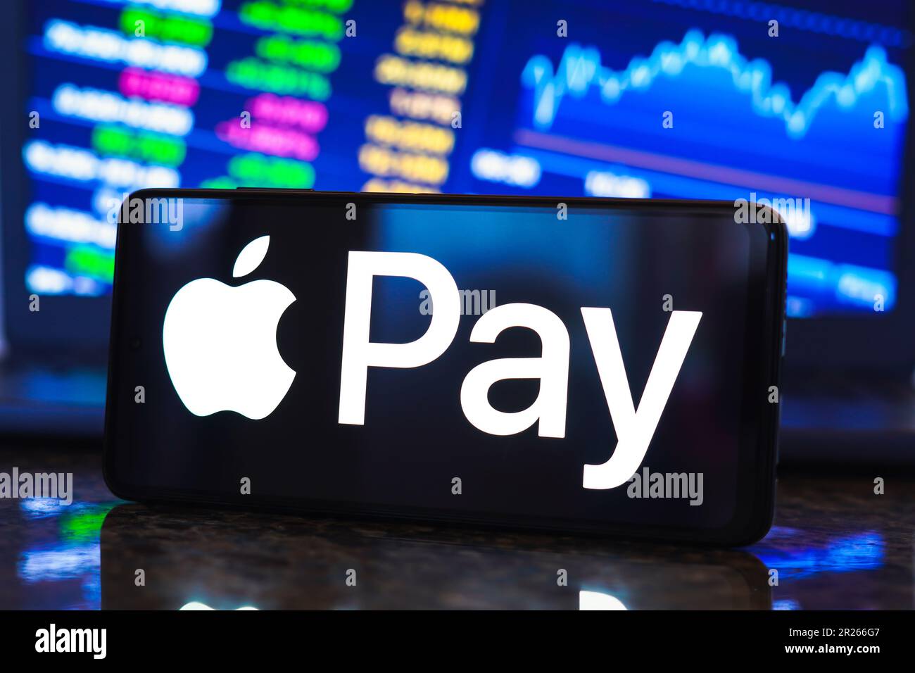 In this photo illustration, the Apple Pay logo is displayed on a ...