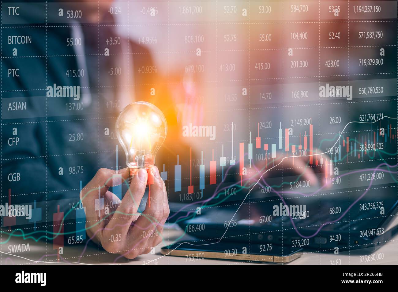 Businessman hand hold light bulb with tablet concept and Stock market ...