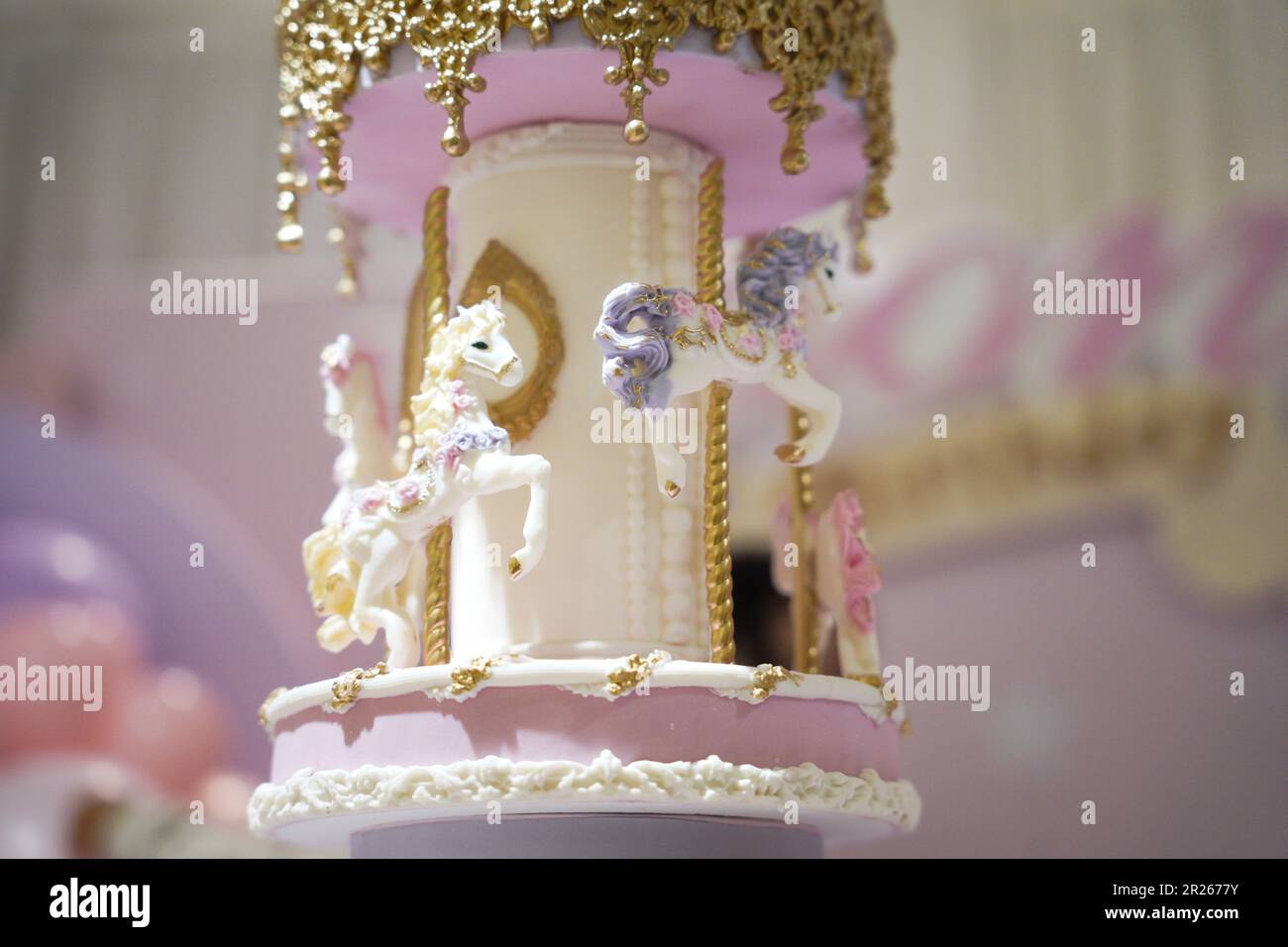 Birthday cake carousel decoration closeup. A nice huge cake with ...