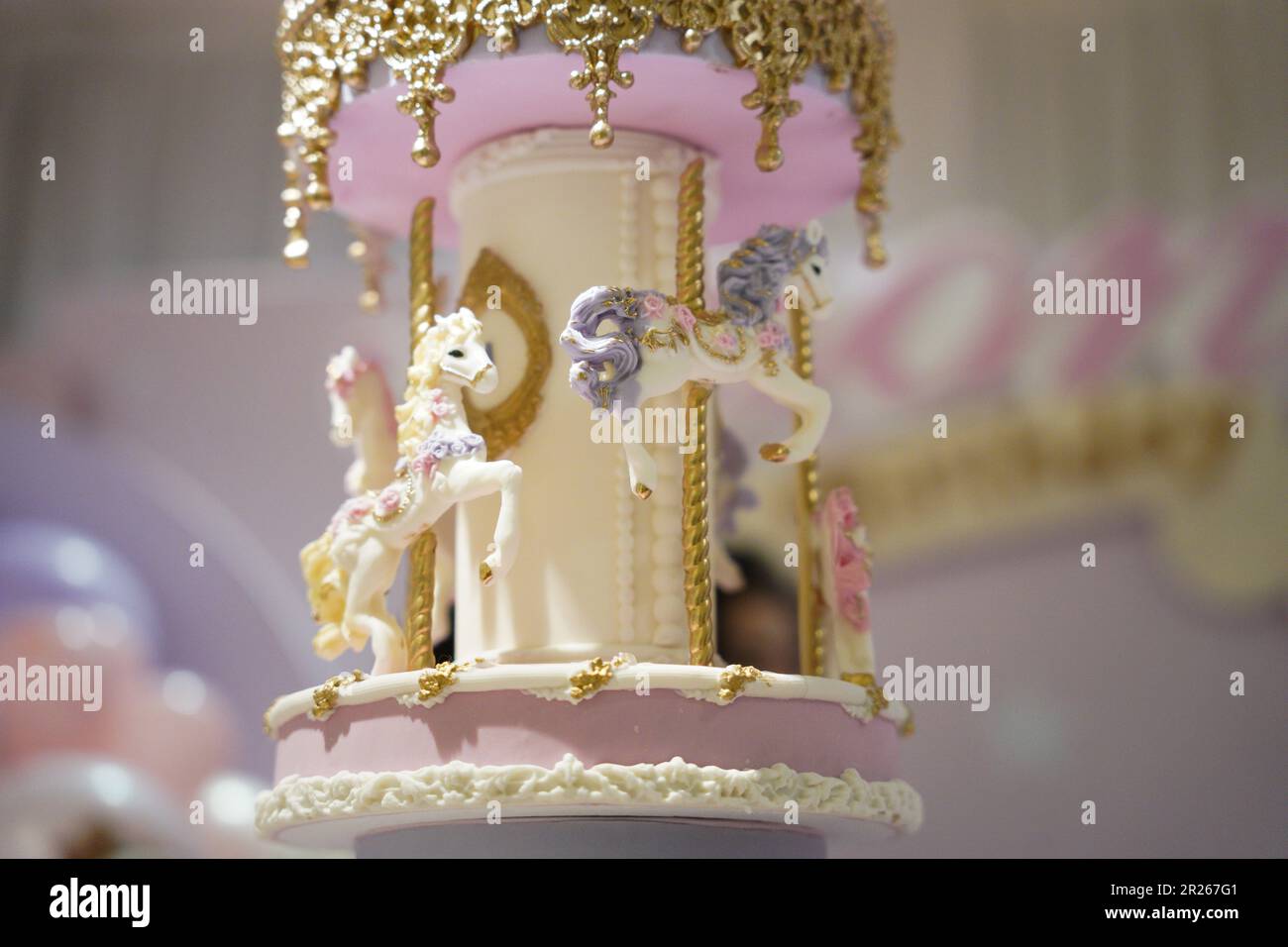 Birthday cake carousel decoration closeup. A nice huge cake with ...
