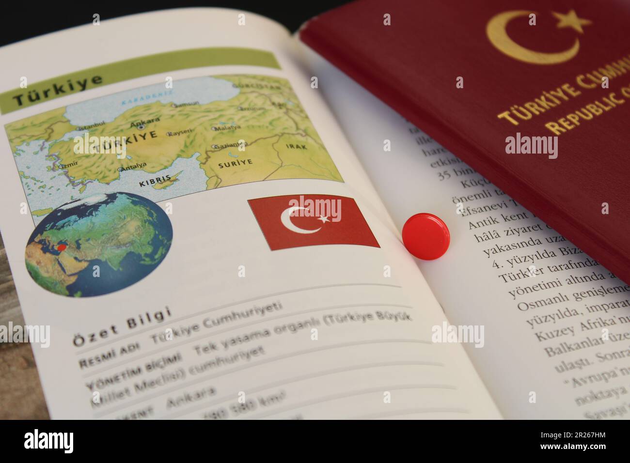 A book with a turkish passport and a turkey flag on it. Turkish map and ...