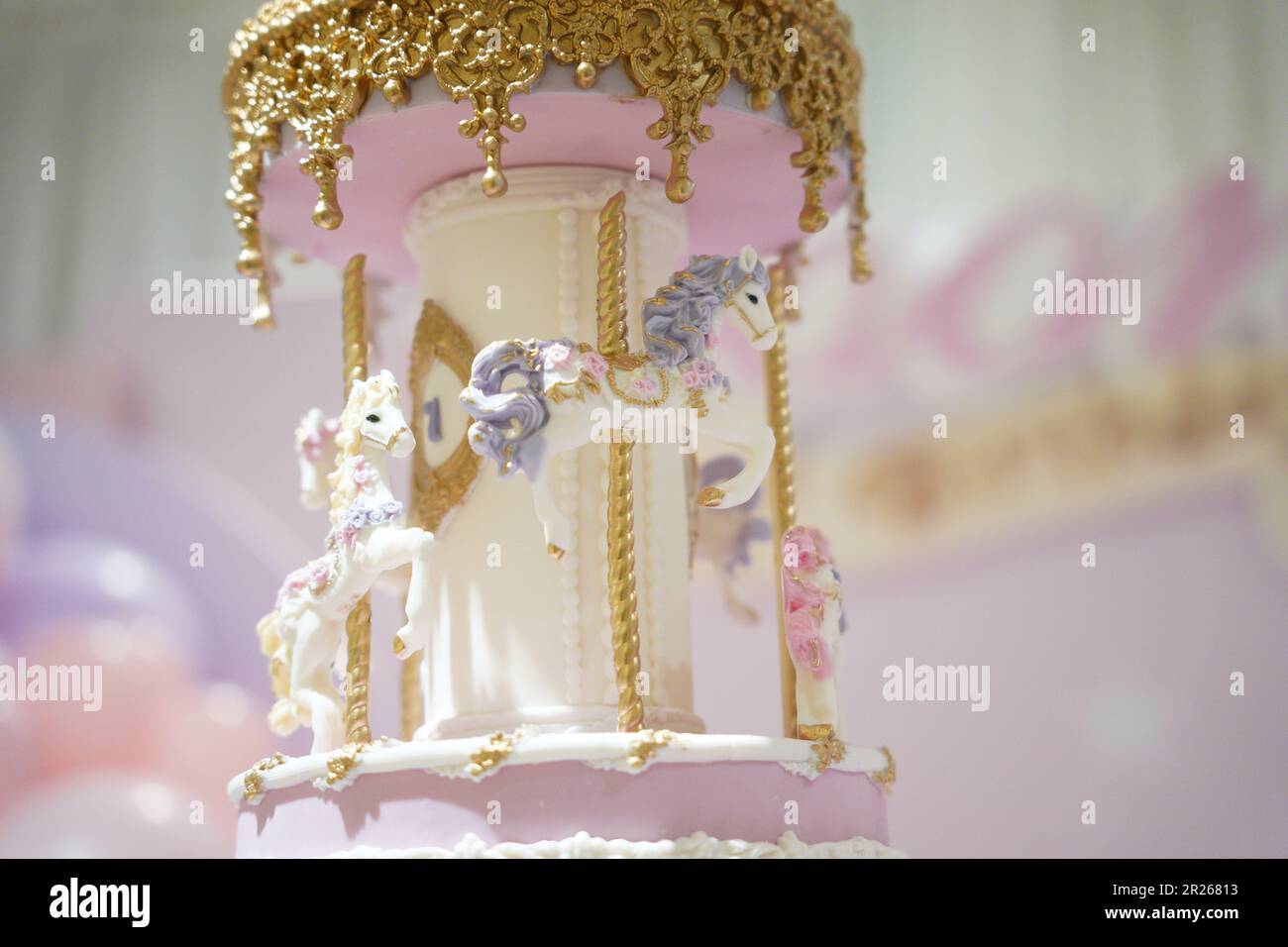 Birthday cake carousel decoration closeup. A nice huge cake with ...