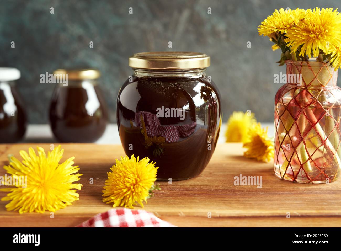 Homemade dandelion syrup in a glass jar on a table Stock Photo - Alamy