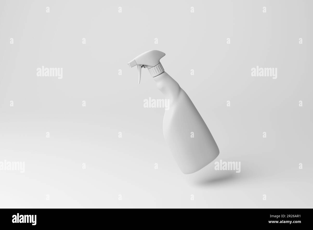 White cleaning spray bottle in mid-air on white background creating ...