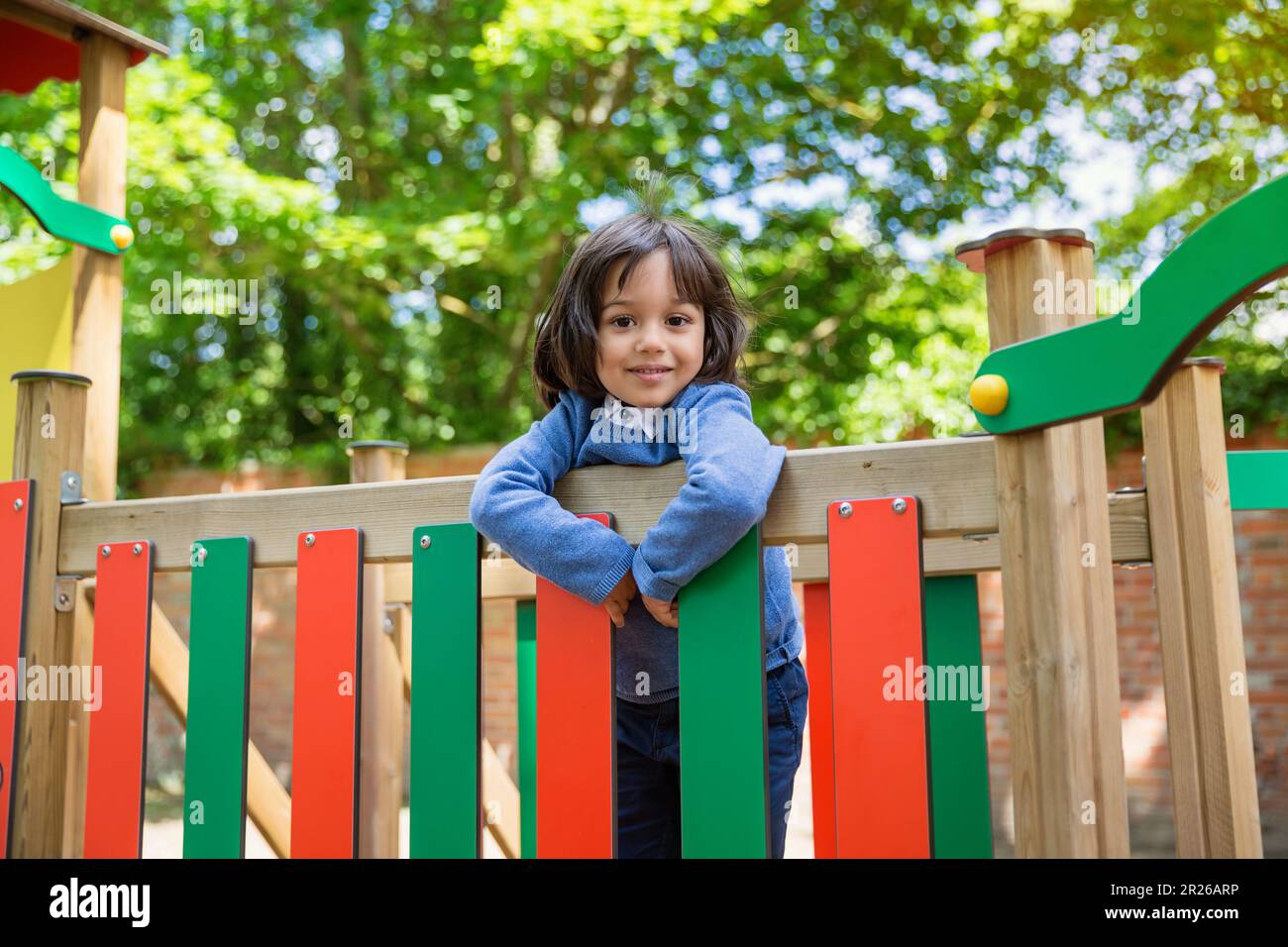 Child playing on outdoor playground Stock Photo - Alamy