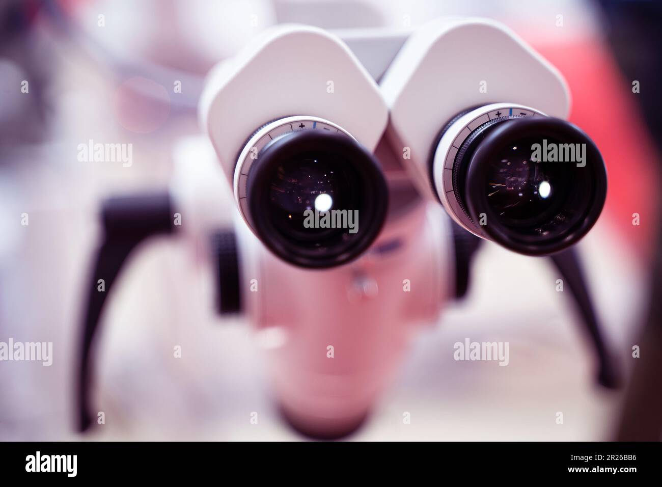 extreme closeup of medical microscope ocular black lenses with ...