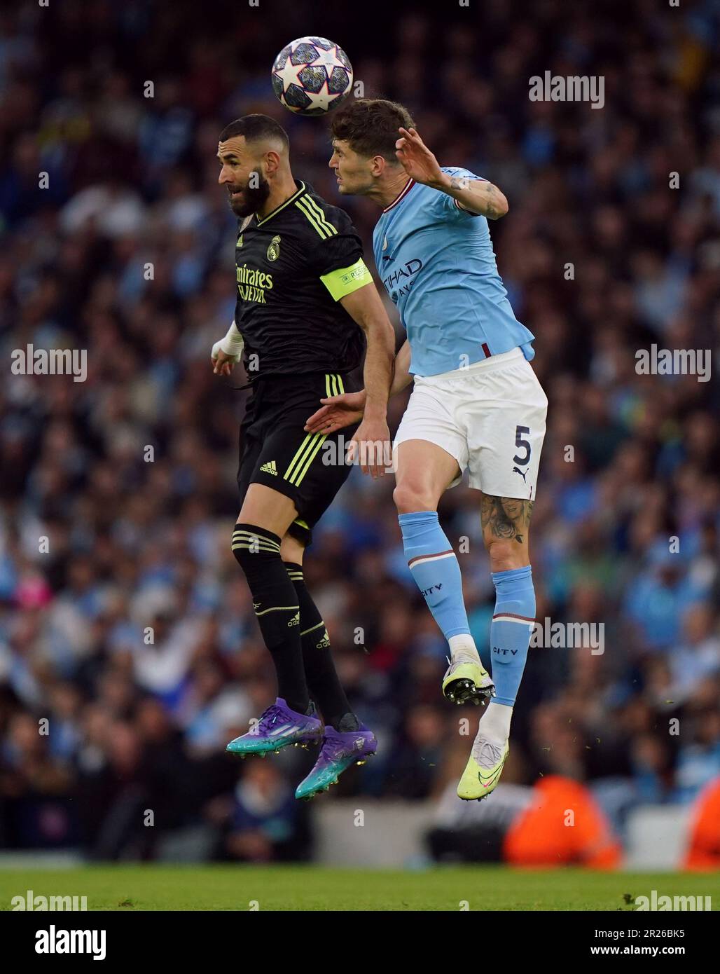 Real Madrid's Karim Benzema and Manchester City's John Stones (right ...