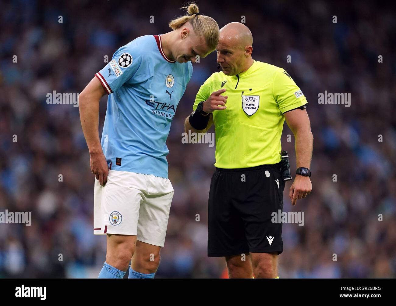 Manchester City's Erling Haaland with referee Szymon Marciniak during ...