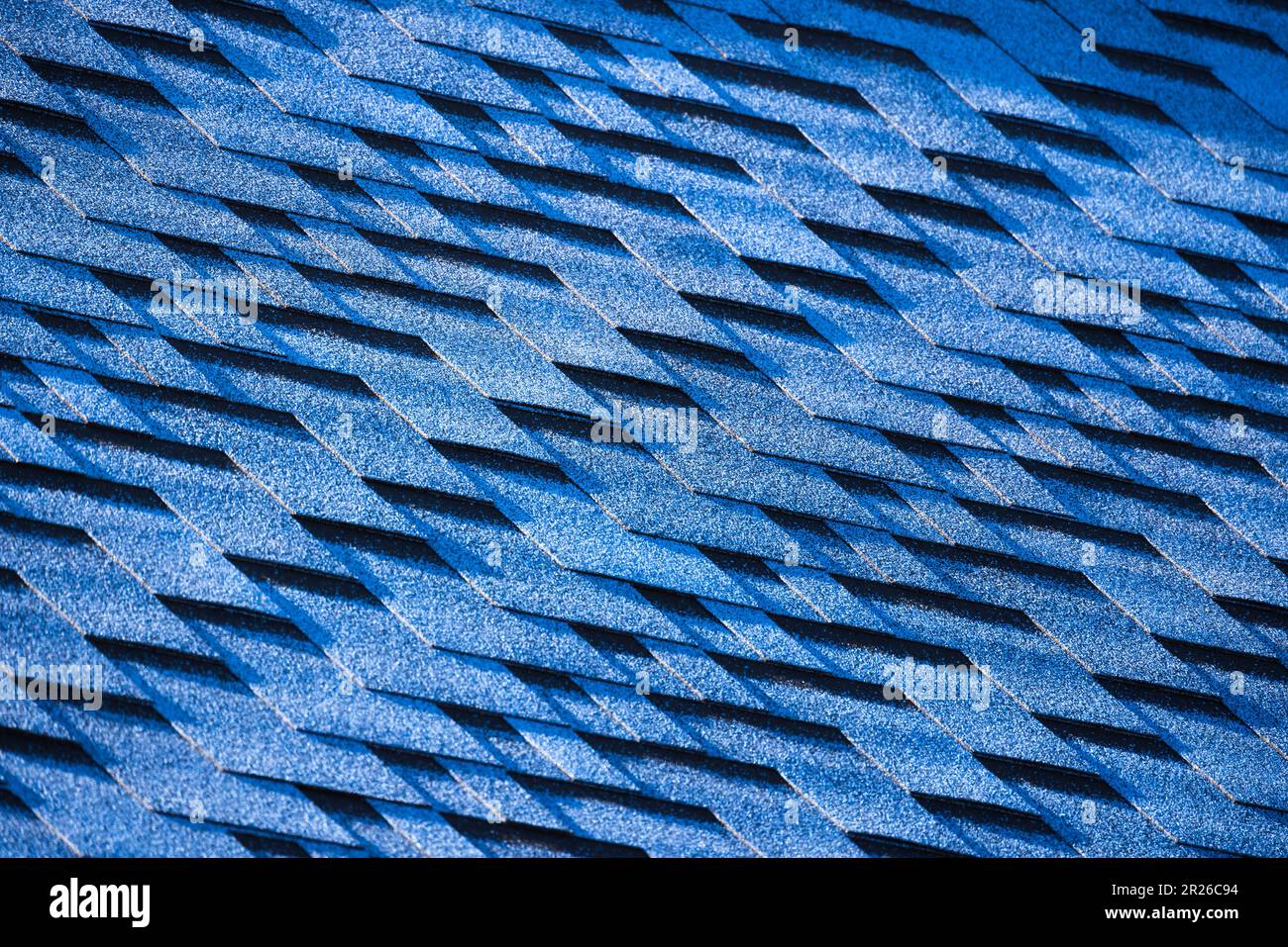 Modern blue roof tiling made of flexible shingles, background photo ...