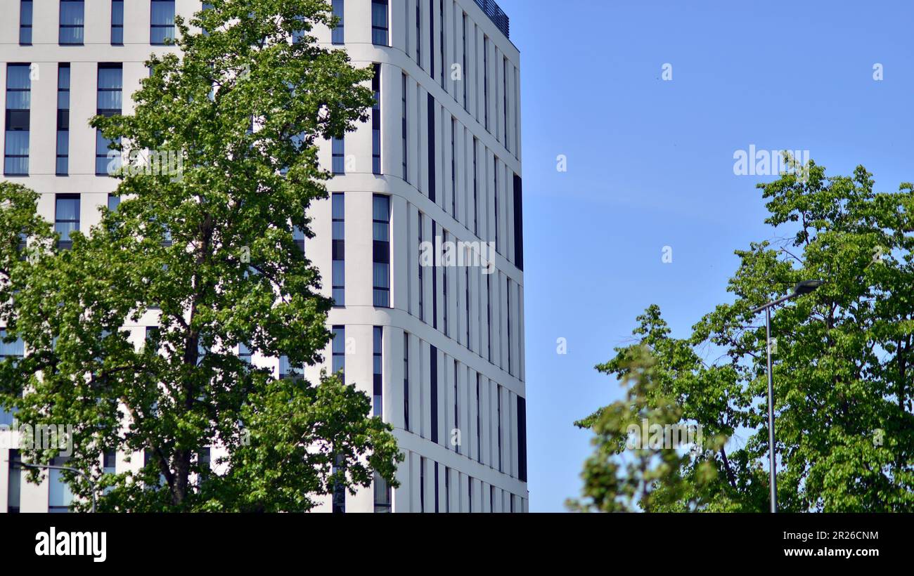 Reflection of modern commercial building on glass with sunlight. Eco ...