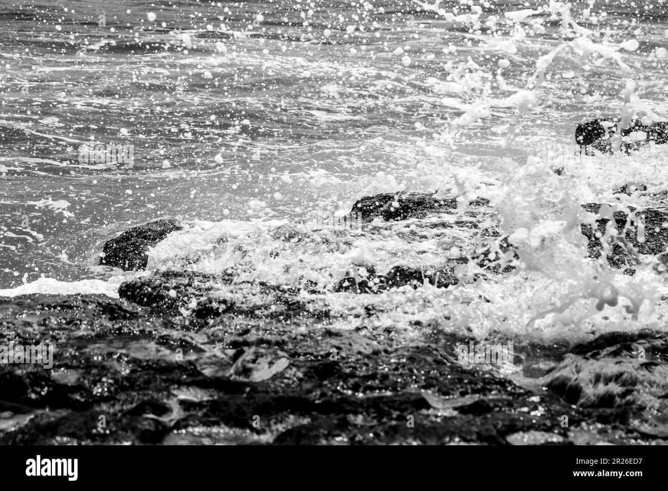 Breaking waves in rocks Black and White Stock Photos & Images - Alamy