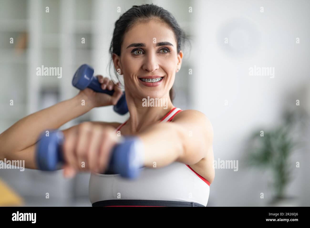 Indian woman exercising dumbbell hi-res stock photography and images ...