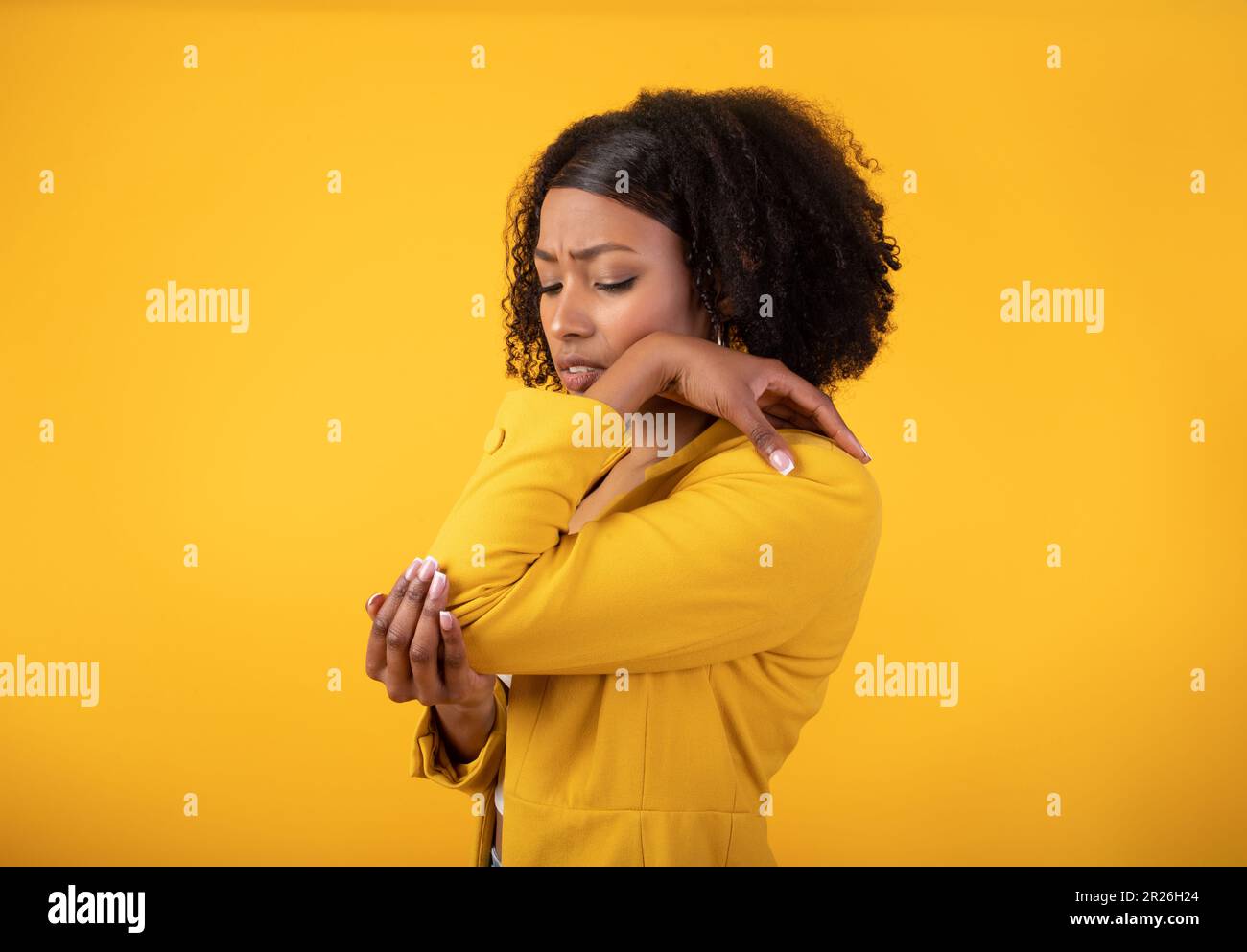 Young african american lady feeling pain in elbow, having trauma ...