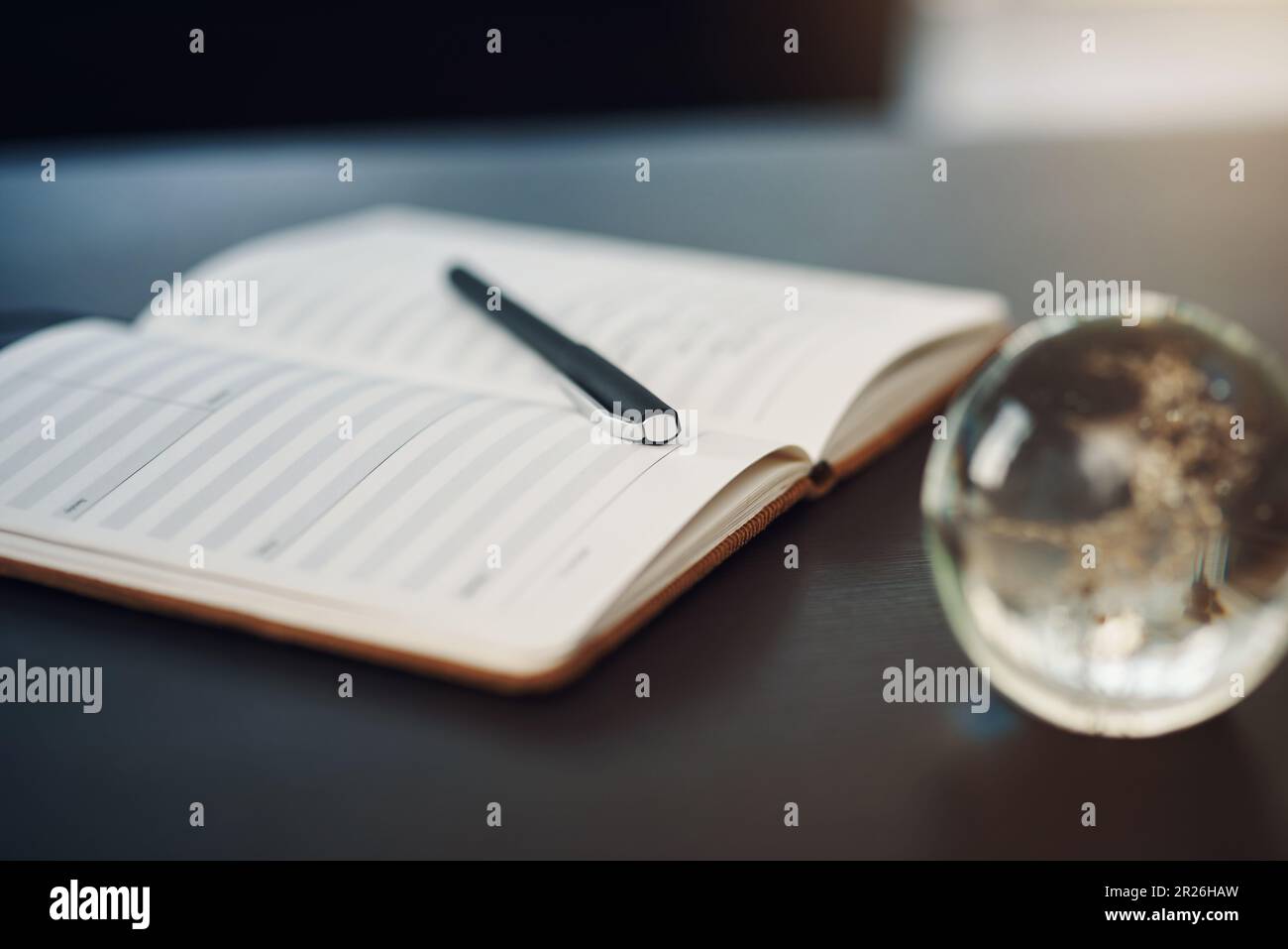 Its time to make a new plan. Still life shot of a notebook and pen on a ...