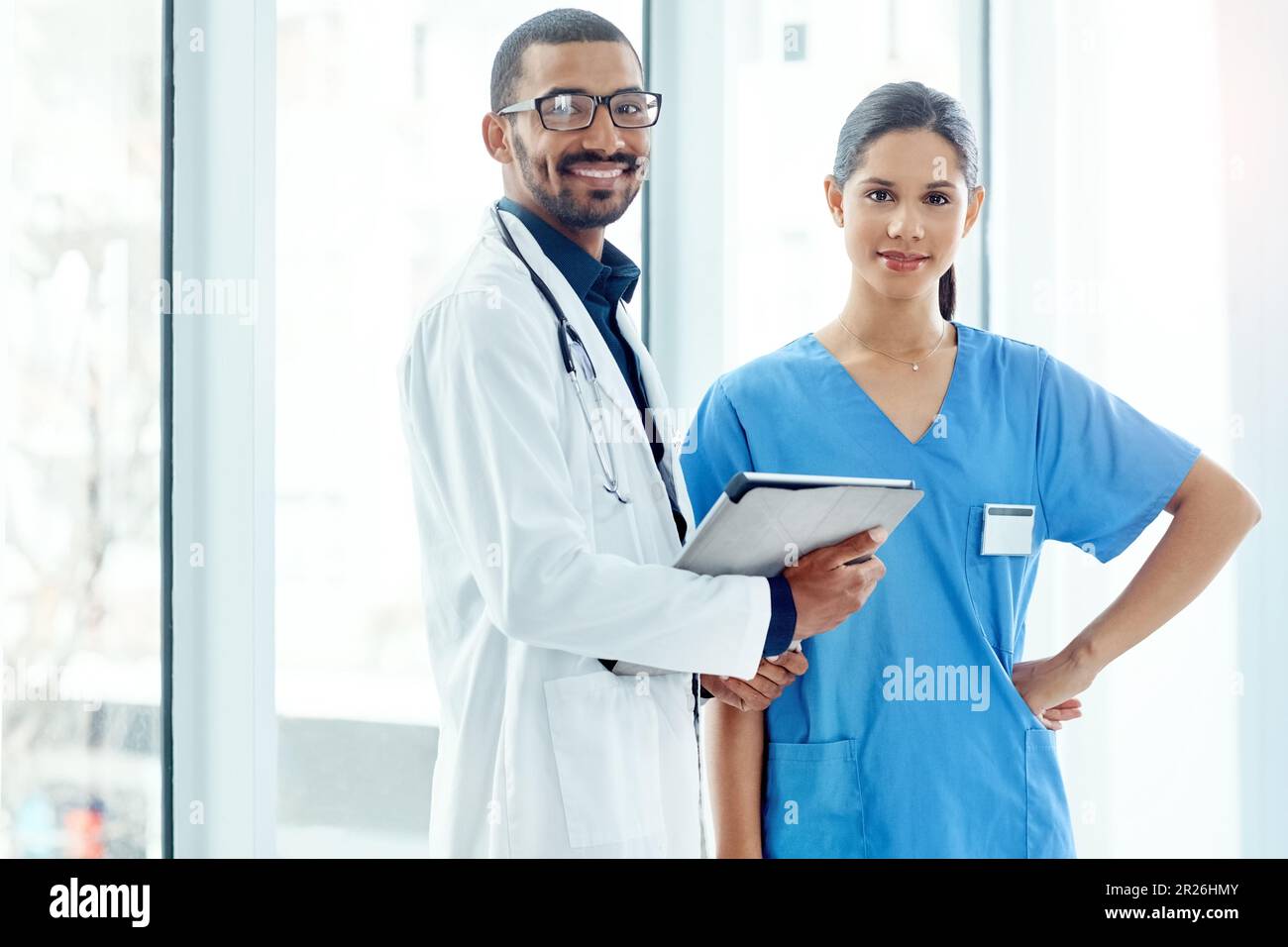 Leaders in the world of medicine. Portrait of two young doctors using a ...