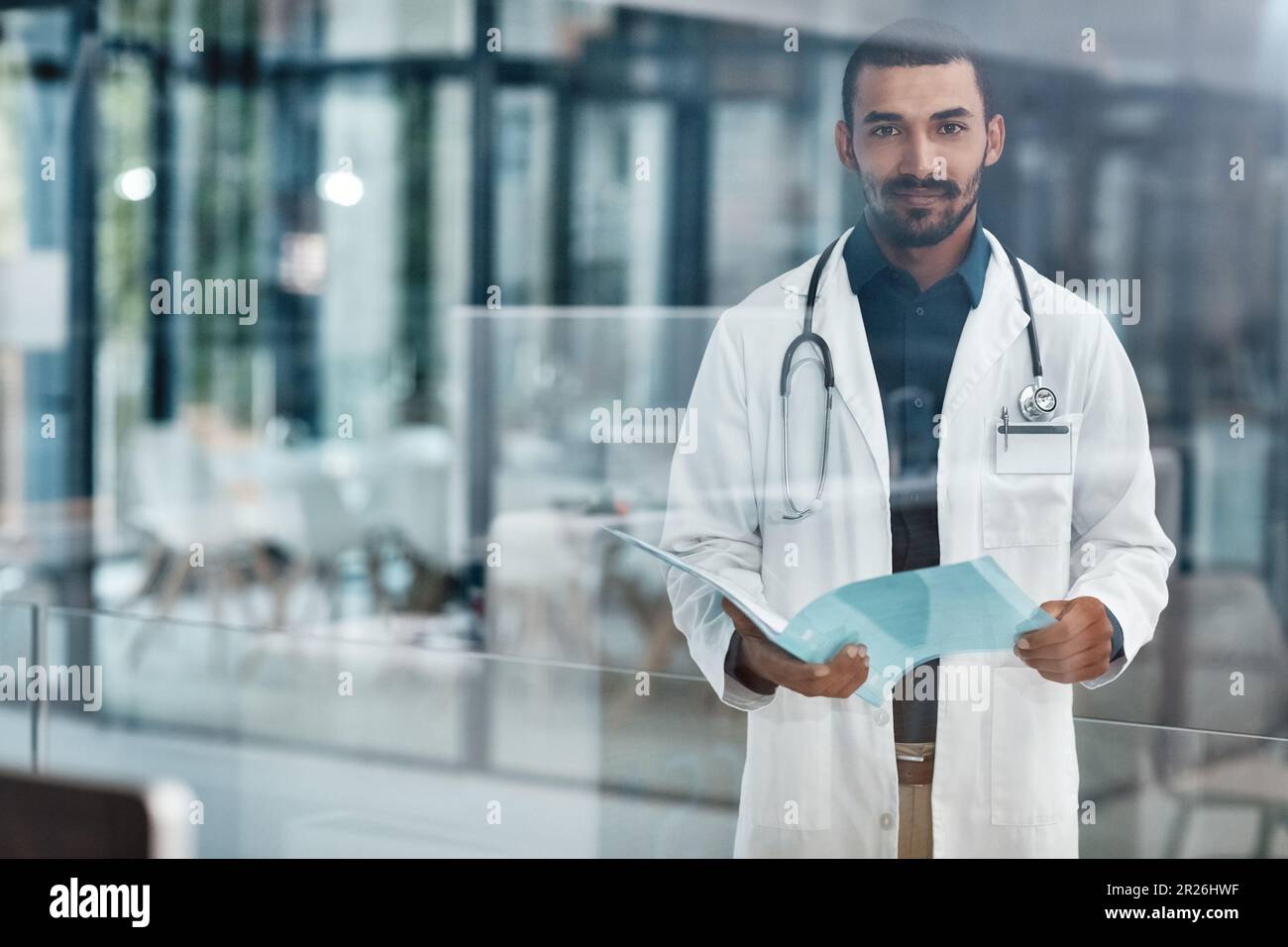 What seems to be the problem. Portrait of a young doctor going over the ...