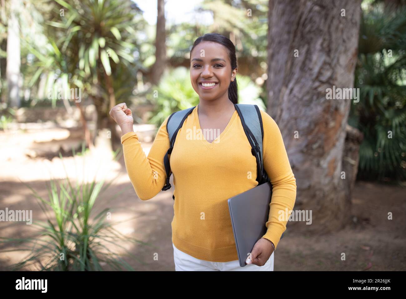 Passed exam. Excited brazilian student girl shaking fist, ccelebrating ...
