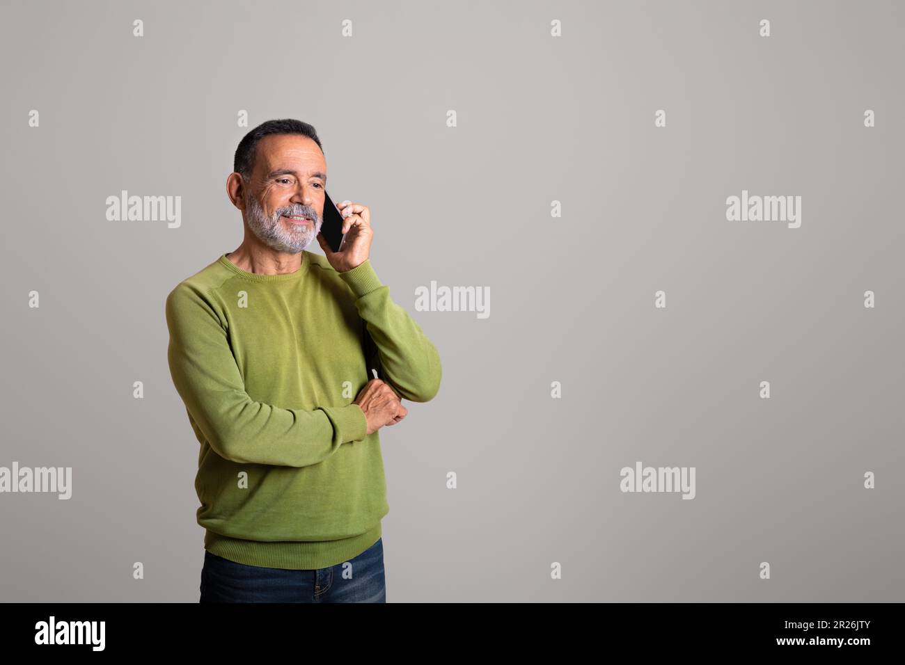 Smiling handsome old european man calls by smartphone, talking Stock ...