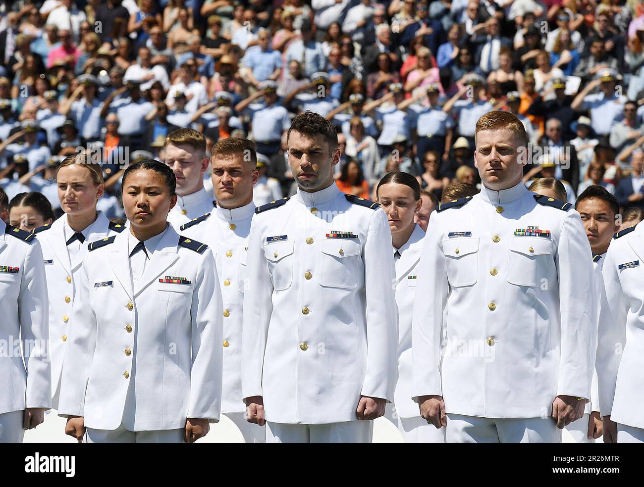 Cadets stand at attention for the national anthem during the United ...