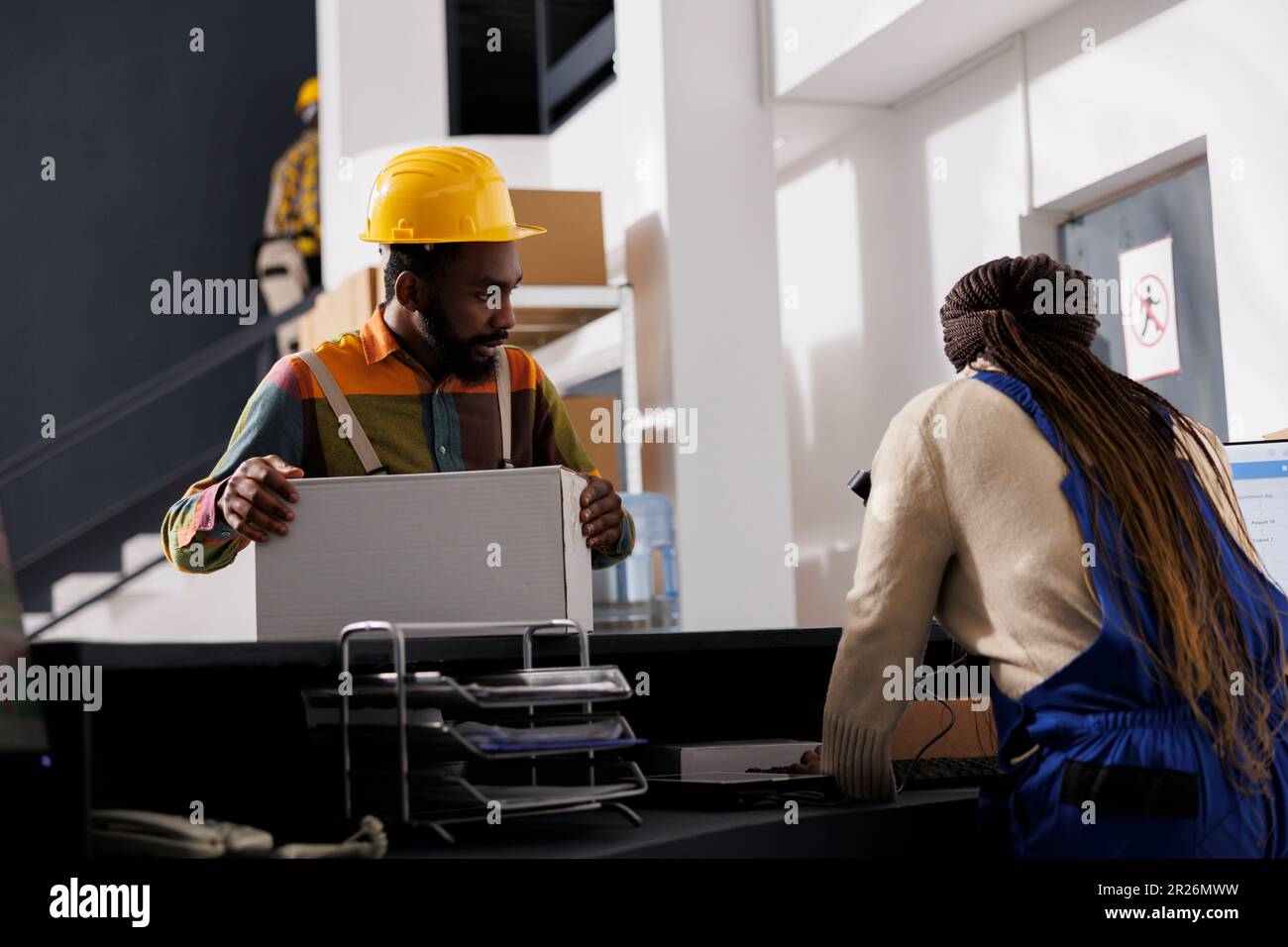 Shipment manager waiting for parcel electronic invoice at reception ...