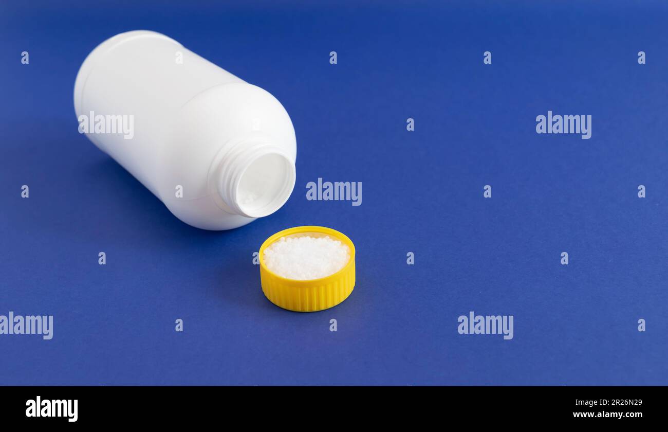 Plumber drain granules in Yellow Cap, White Plastic Bottle On Blue ...