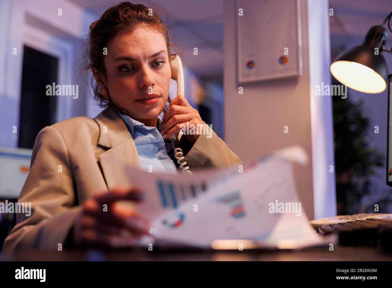 Executive manager talking at landline phone with remote employee Stock ...