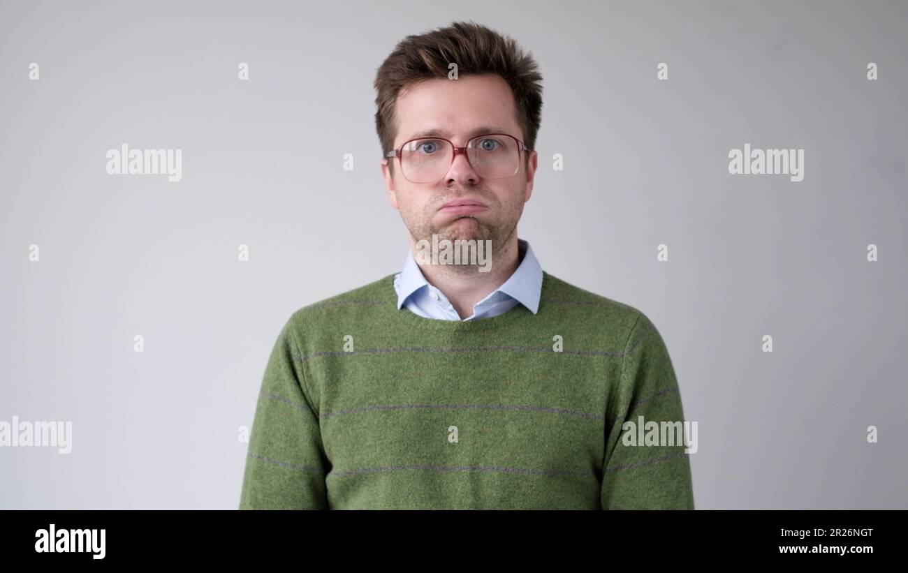 The angry European young man wearily looks. He is without strength and ...
