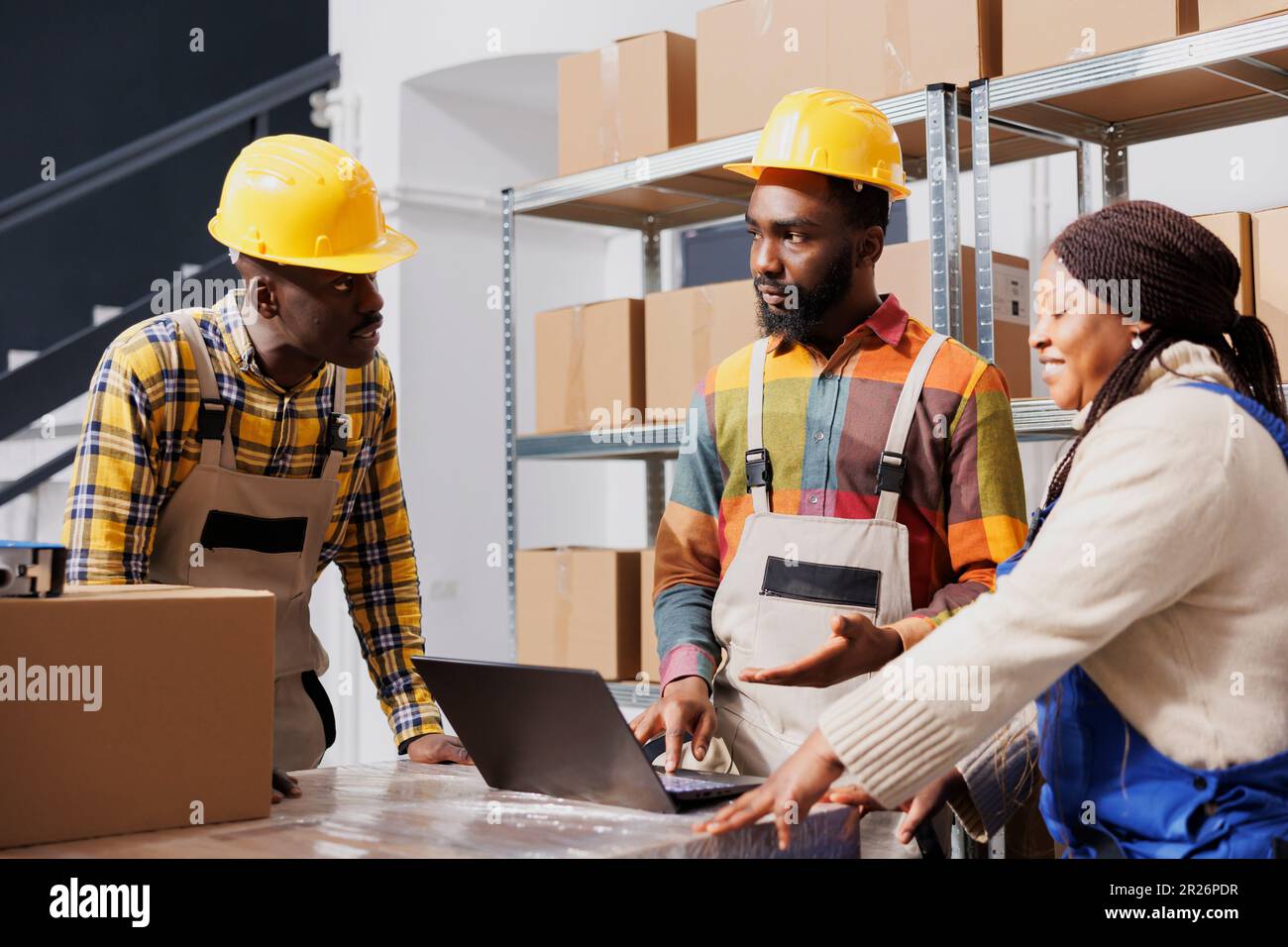 Delivery service workers checking order products list on laptop Stock ...