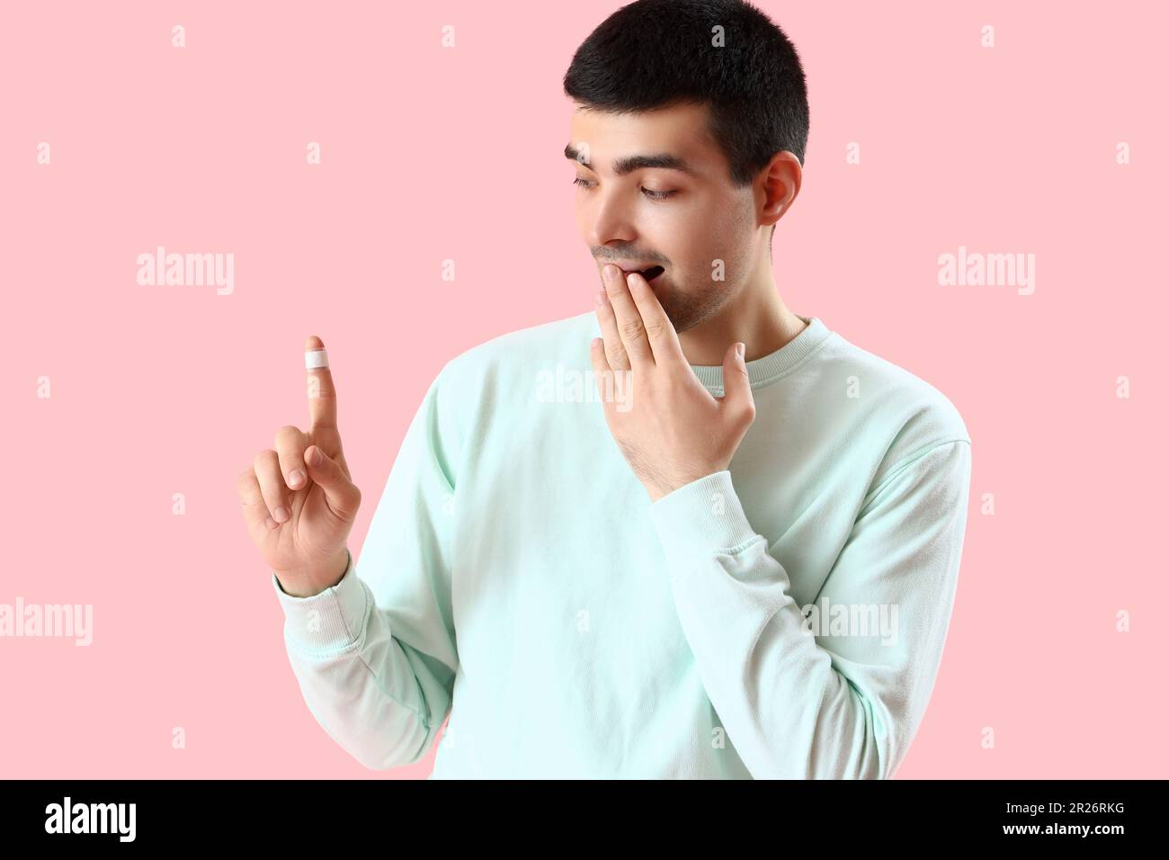 Young man taped finger hi-res stock photography and images - Alamy