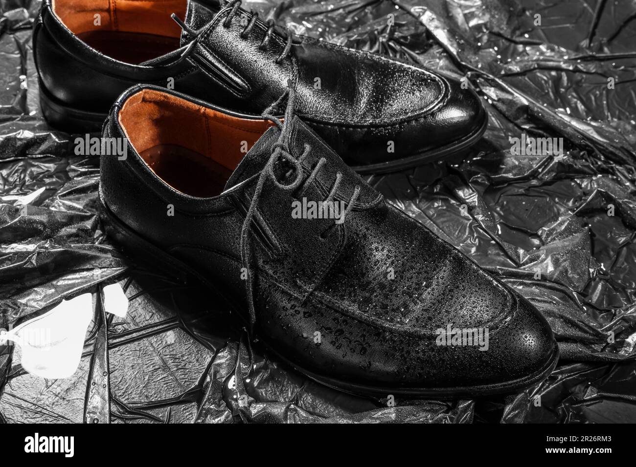 Stylish classic male shoes with water drops on black background Stock ...