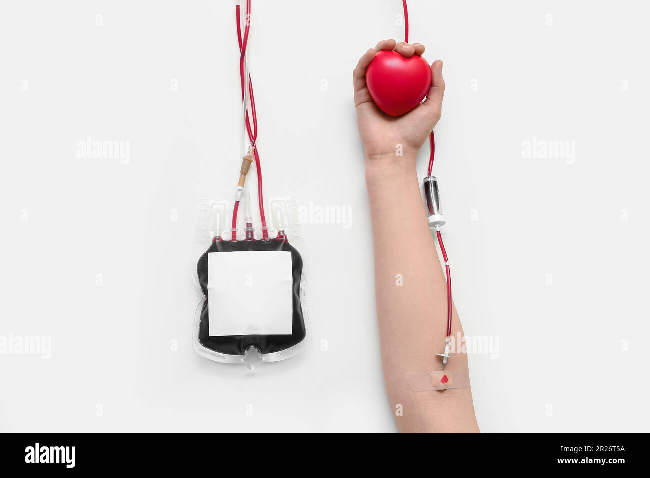 Woman donating blood on beige background. World Donor Day Stock Photo ...