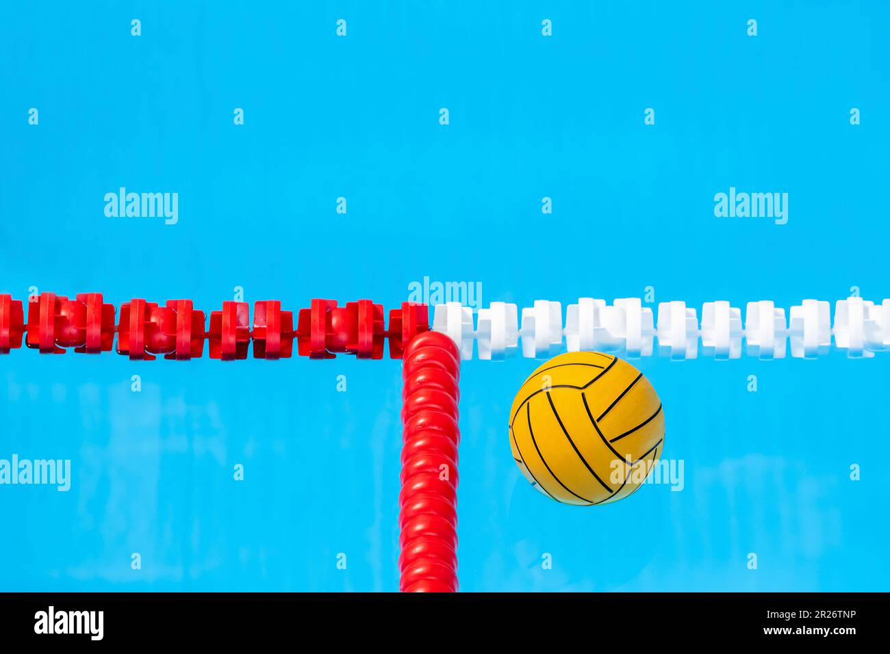 Yellow water polo ball on swimming pool surface for game, competition ...