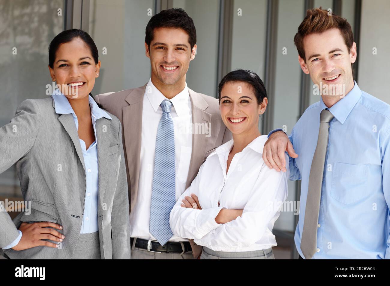 They gel exceptionally well as a team. Four confident businesspeople ...