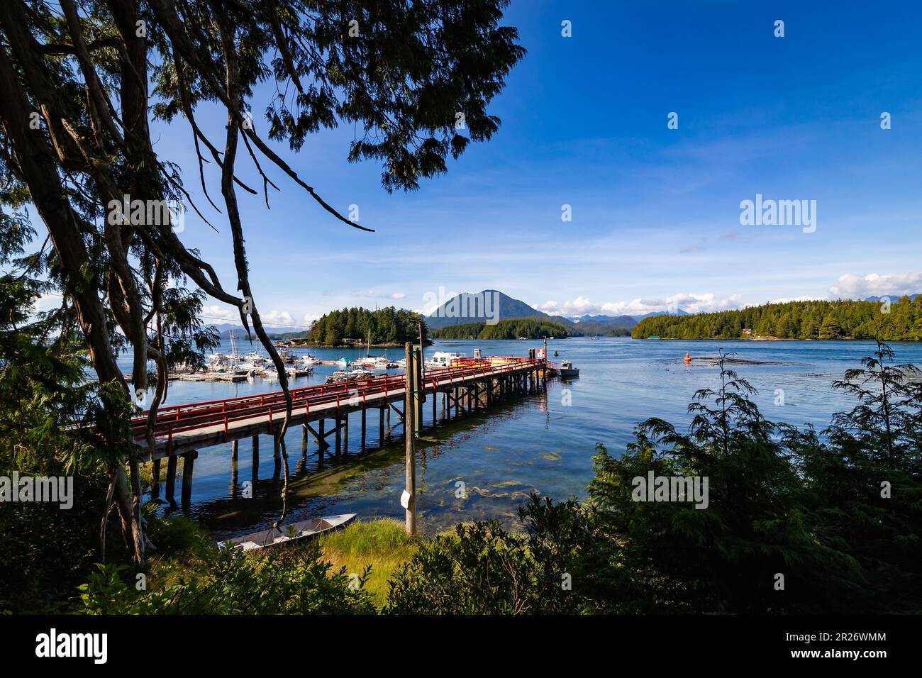 The wharf protrudes from the shore of the Pacific Ocean to provide a ...