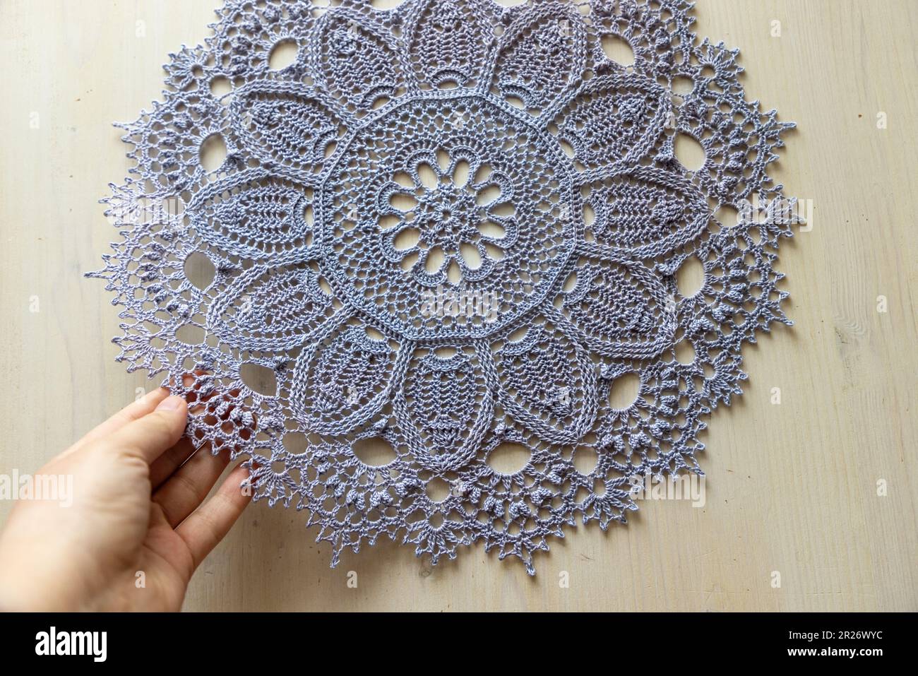 Purple crochet doily Stock Photo - Alamy