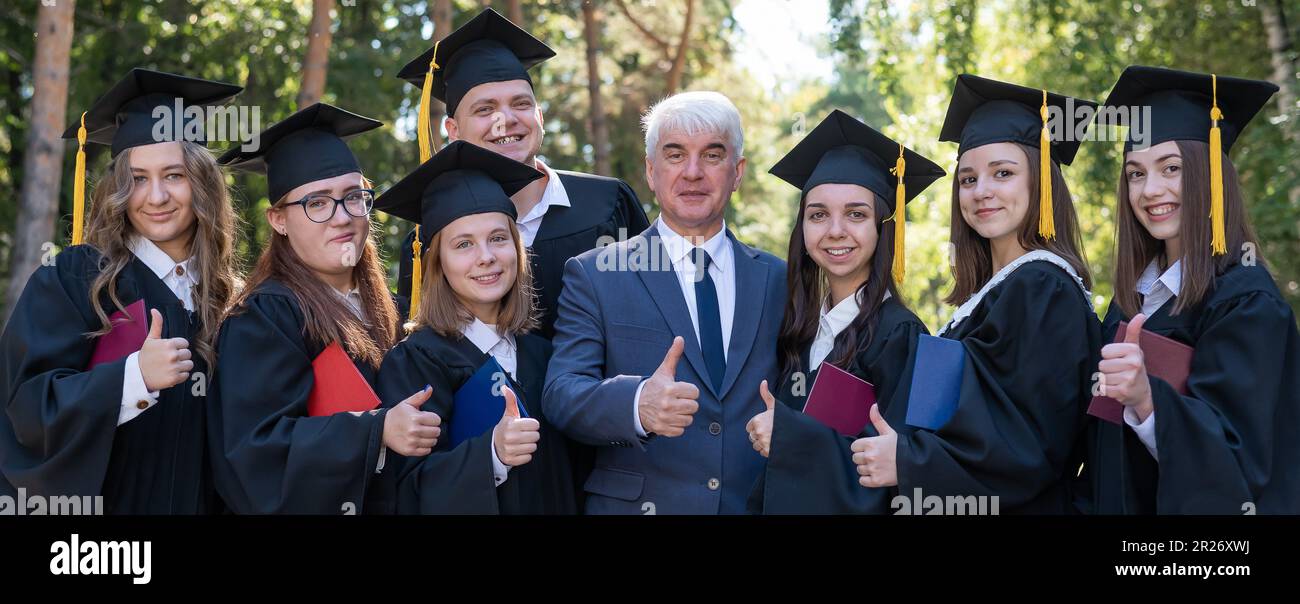University professor and seven students rejoice at graduation and show ...