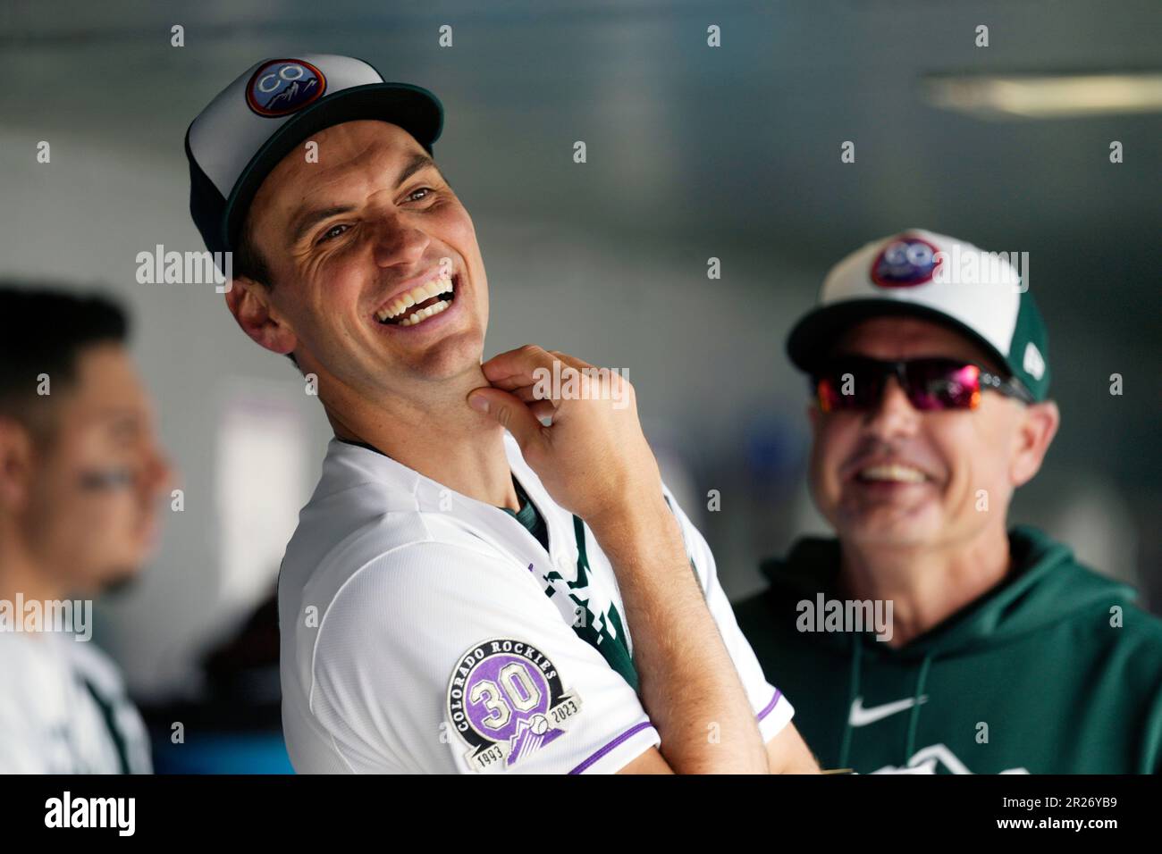 Colorado Rockies relief pitcher Brent Suter, front, jokes with pitching ...