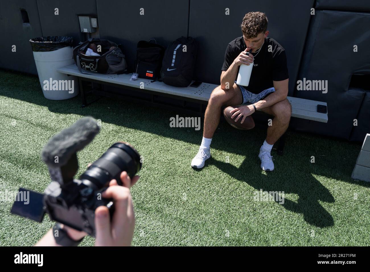 Adam Botkin a football TikTok influencer, records a video for a TikTok ...