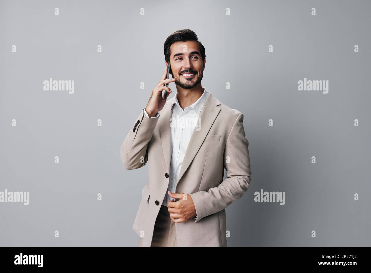 connection man message hold phone business happy phone smile portrait ...