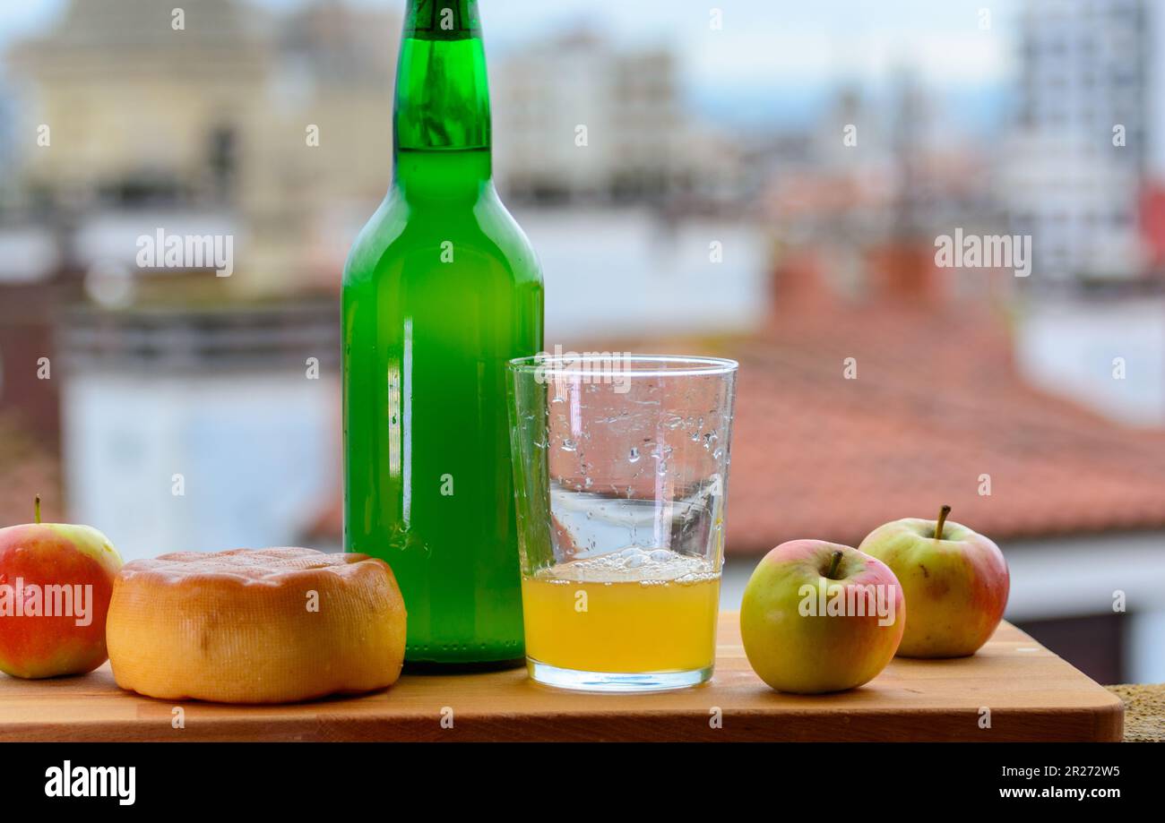 Traditional natural Asturian cider made from fermented apples in wooden ...