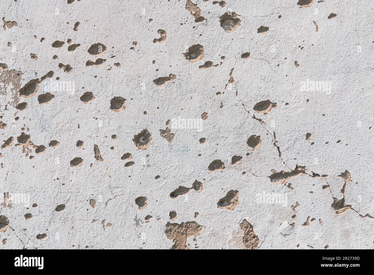The wall of the house damaged by shelling (close-up). The concept of a ...
