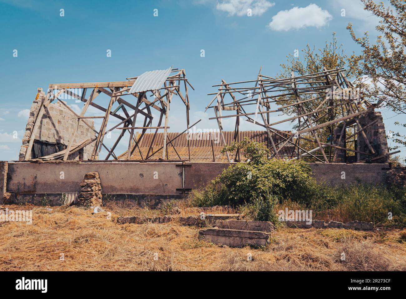 Hangar for agricultural machinery on a farm, destroyed by artillery ...