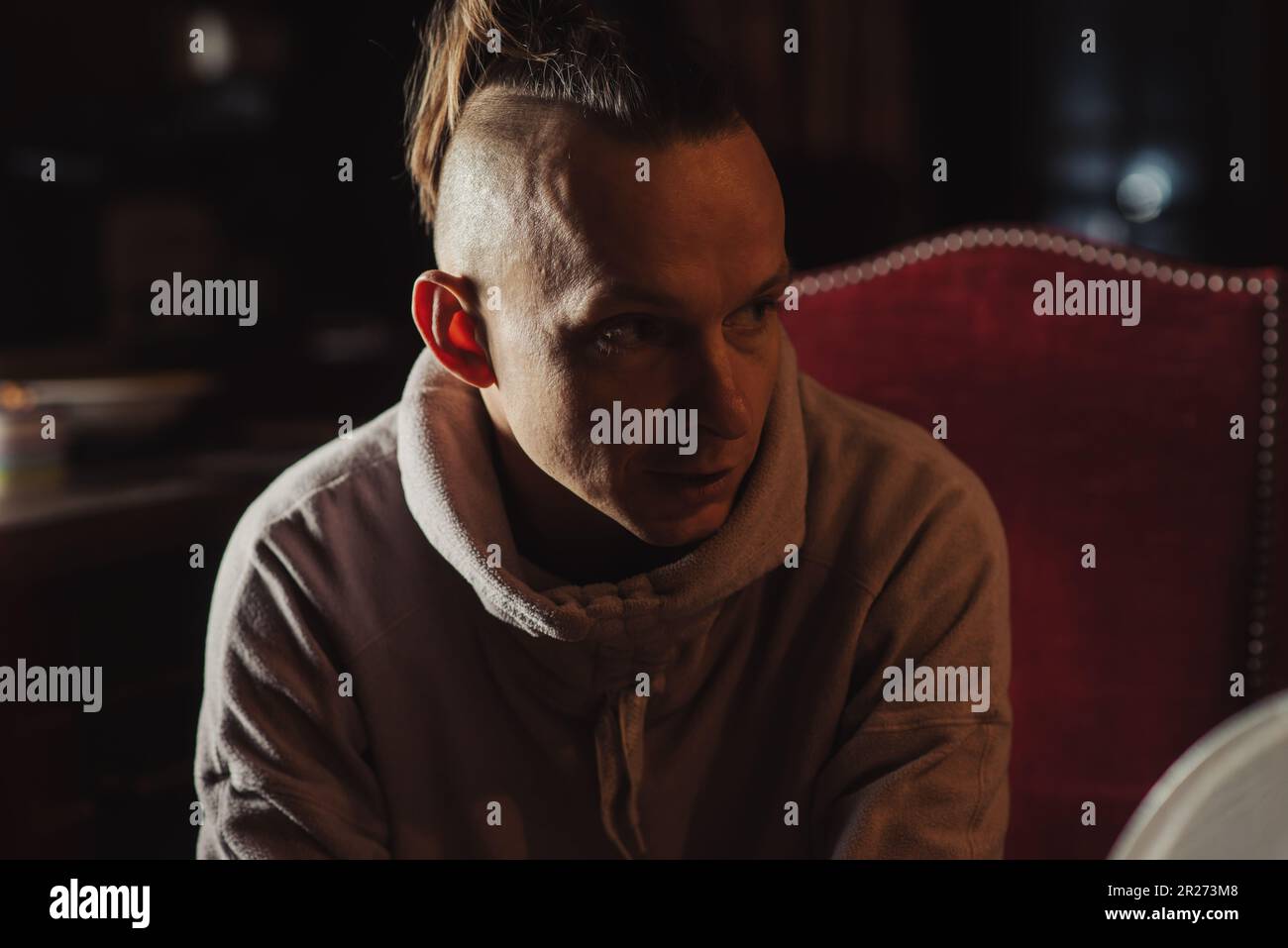 Middle-aged man in a dark room. Ordinary man of thin build Stock Photo ...