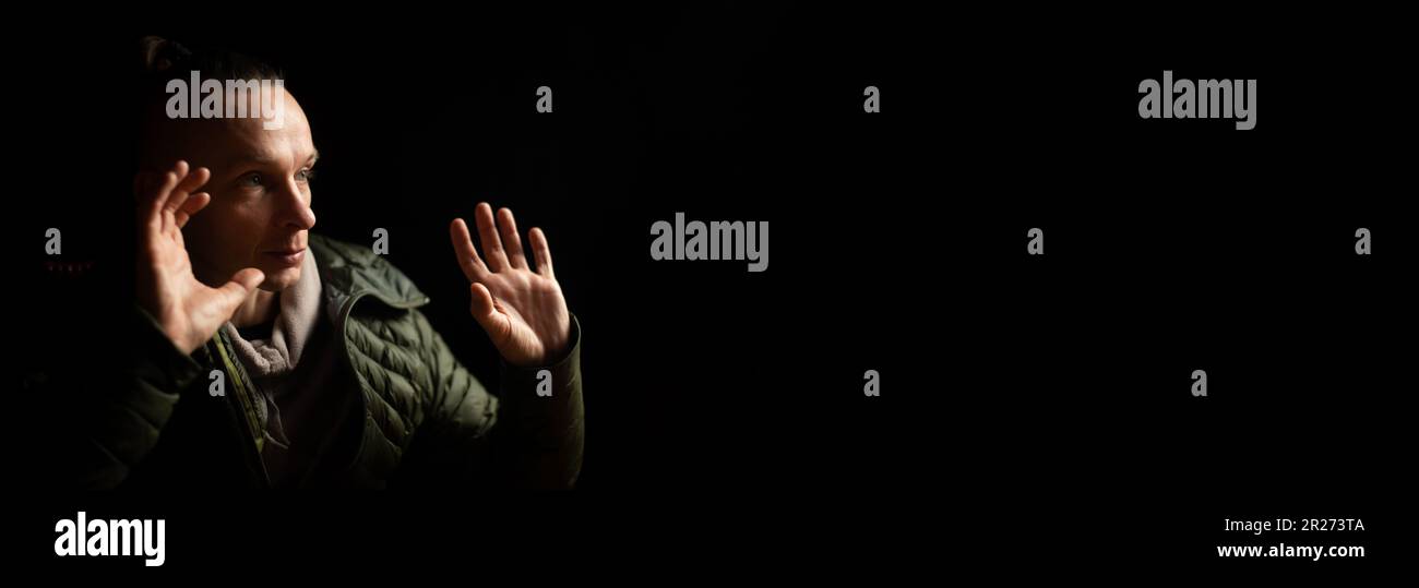 Hand gesture of denial. A thin man holds his hands up. Banner, place ...