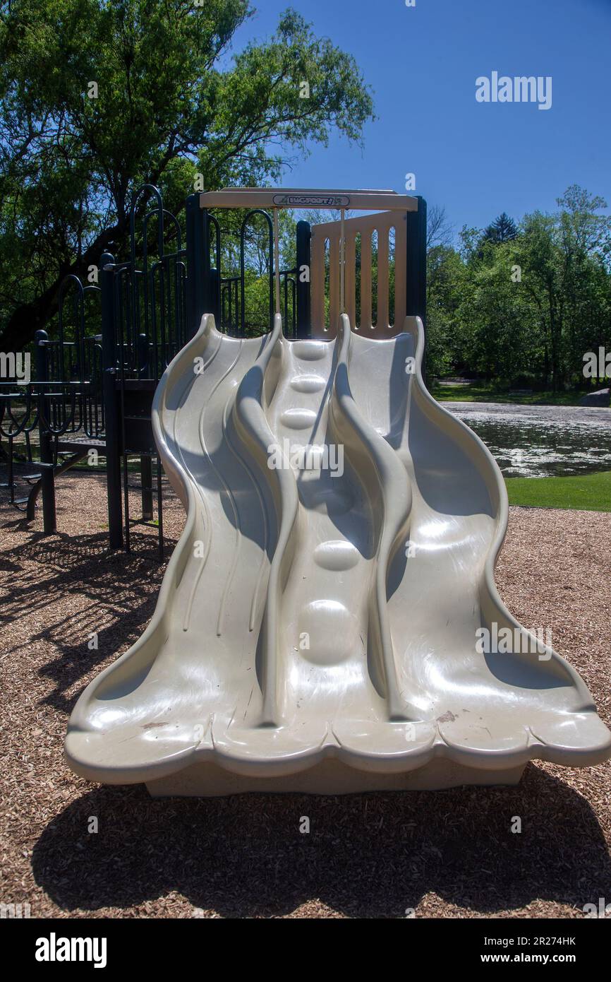 An empty slide in a children's playground Stock Photo - Alamy