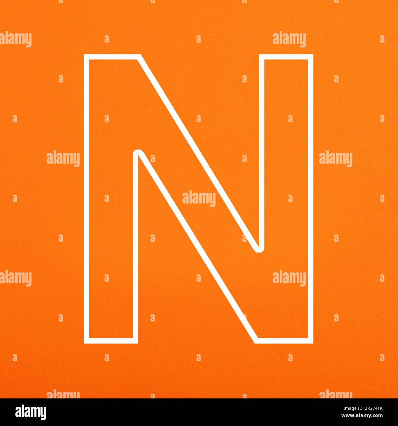 White letter N uppercase on orange foamy background Stock Photo - Alamy