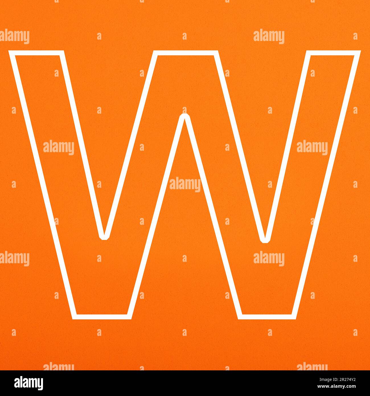 Letter W uppercase written in white color isolated on orange foamy ...