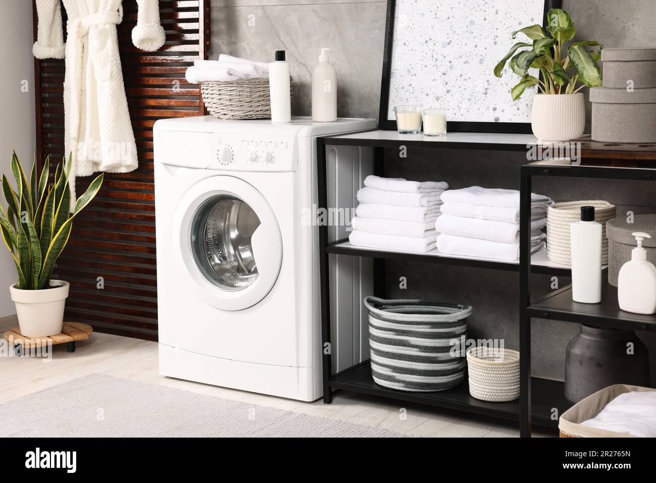 Stylish laundry room with modern washing machine. Interior design Stock ...